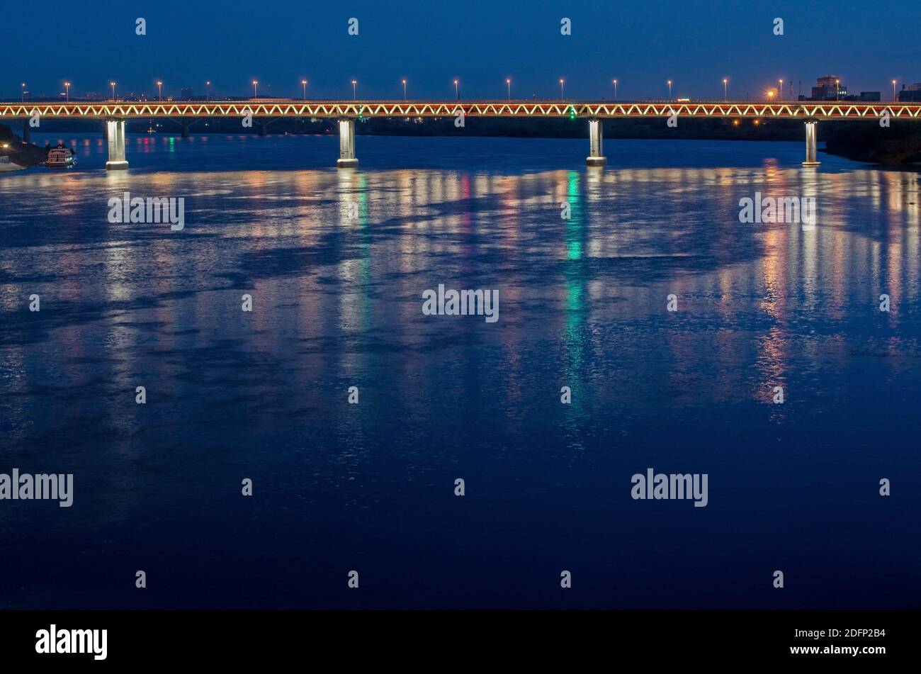 Bridge over night river. Rapid transit and car bridge for traffic flow ...