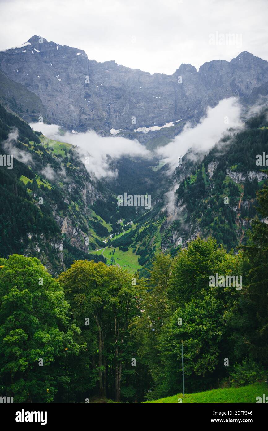 cloudy valley in switzerland swiss alps Stock Photo - Alamy