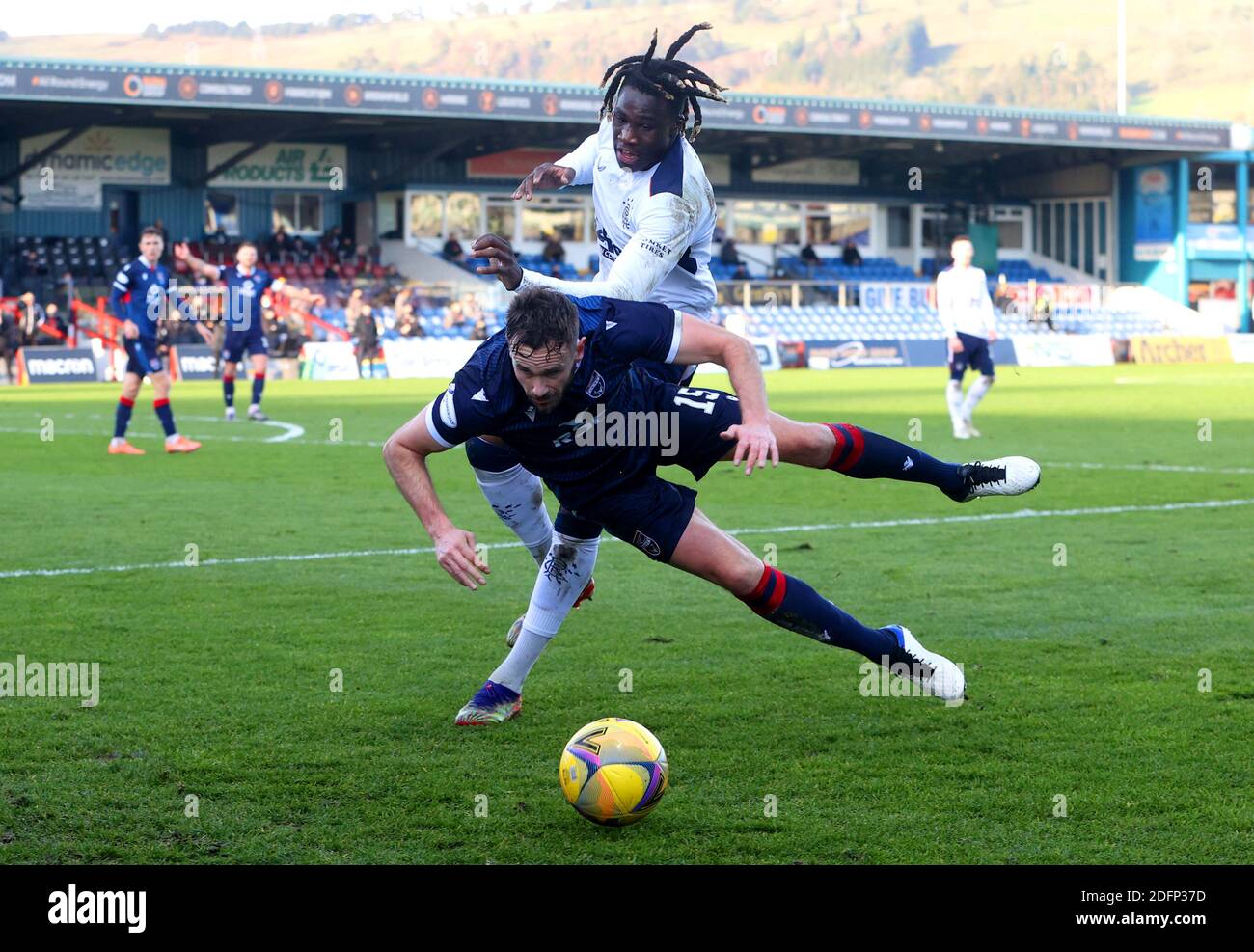 Ross County's Keith Watson (front) and Rangers' Calvin Bassey battle ...