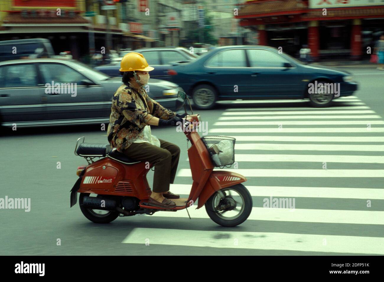 a motorbike on a road in the city centre of Taipei in Taiwan of East ...