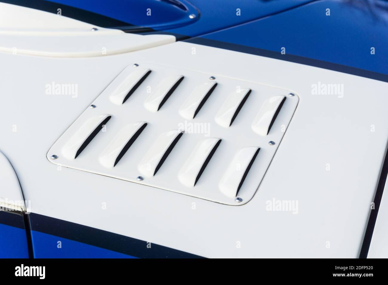 Close up detail of a vent on the roof of a metallic blue and white ...
