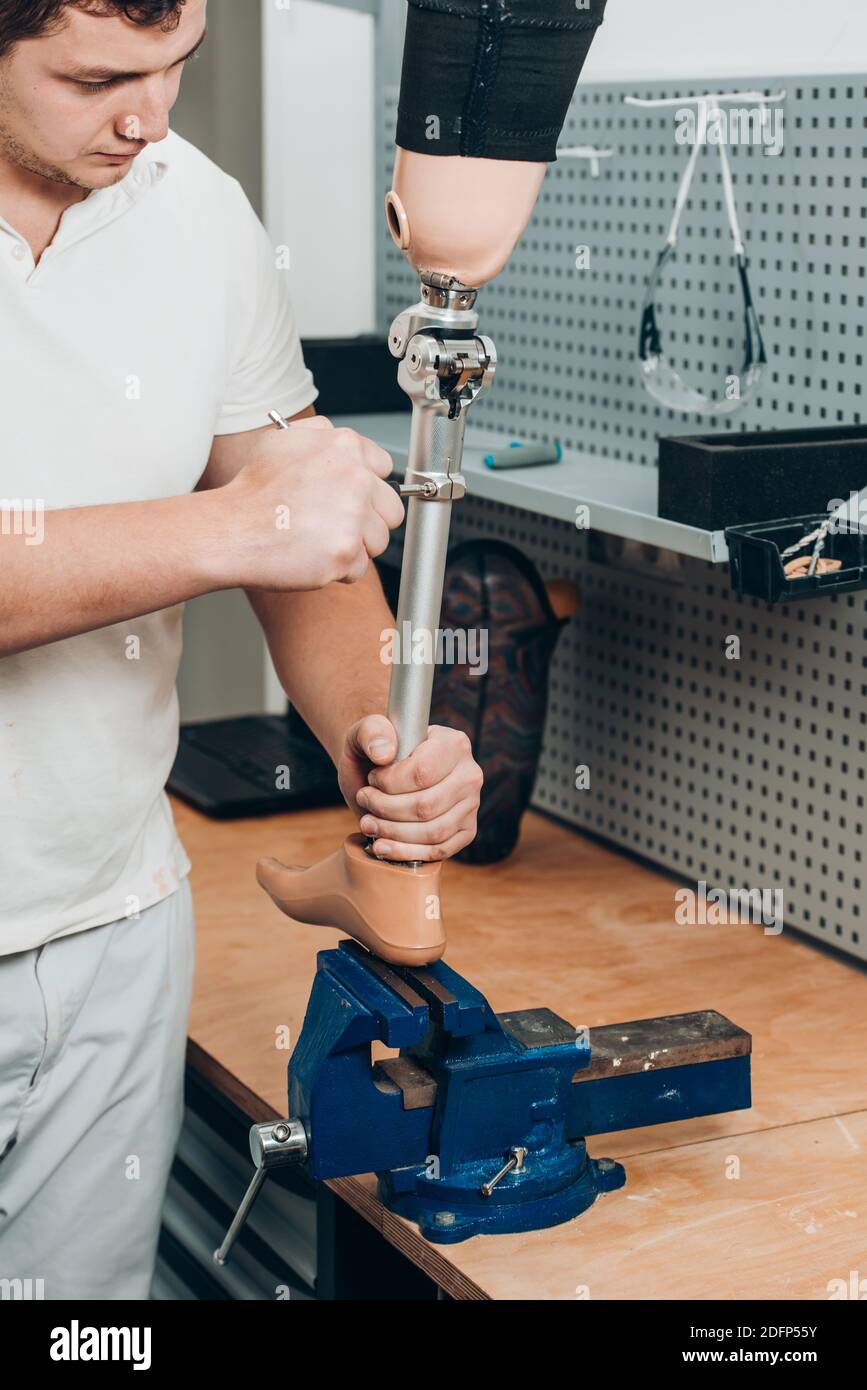 Technician holding prosthetic limb hi-res stock photography and images ...