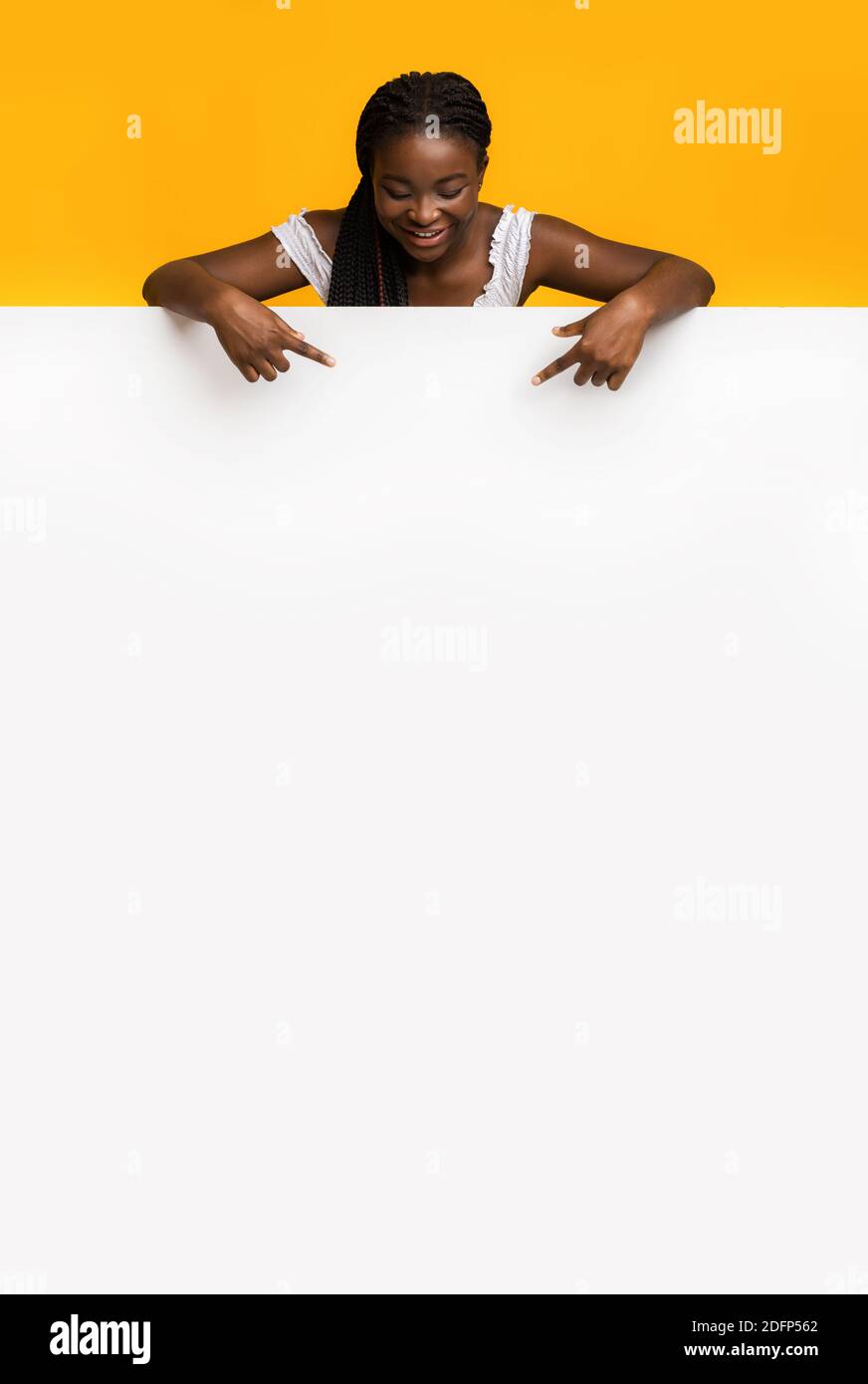 Look There. Black Millennial Lady Pointing Down At White Advertisement ...