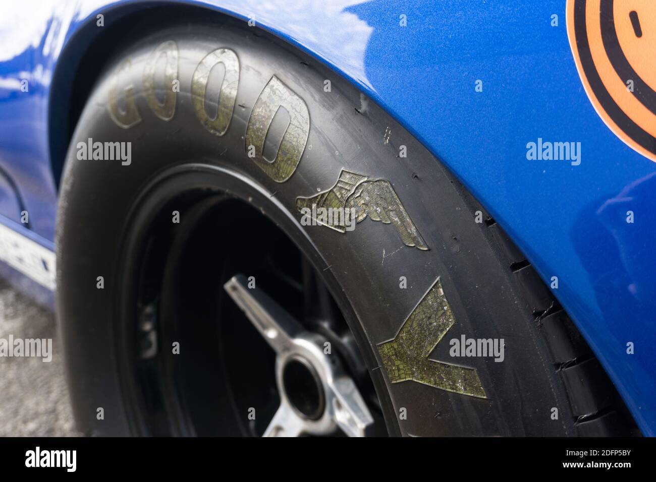 Close up detail of a Goodyear Eagle rear tyre and black alloy wheel on ...