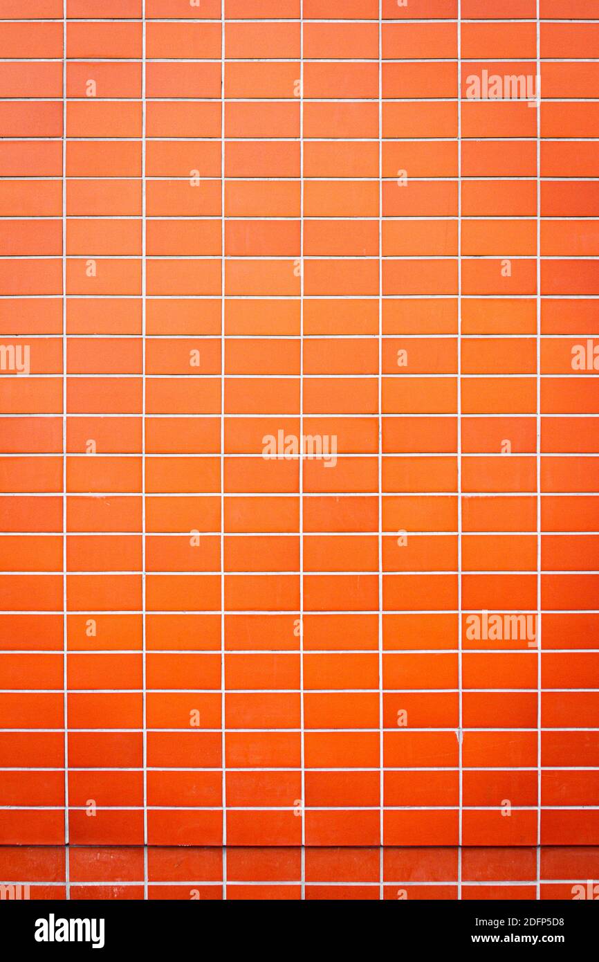 Modern weathered red tile wall texture background Stock Photo - Alamy