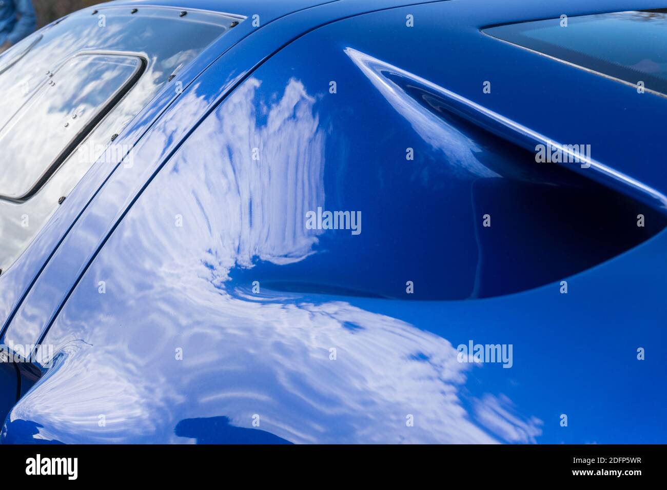 Close up detail of an engine intake duct on a metallic blue and white ...