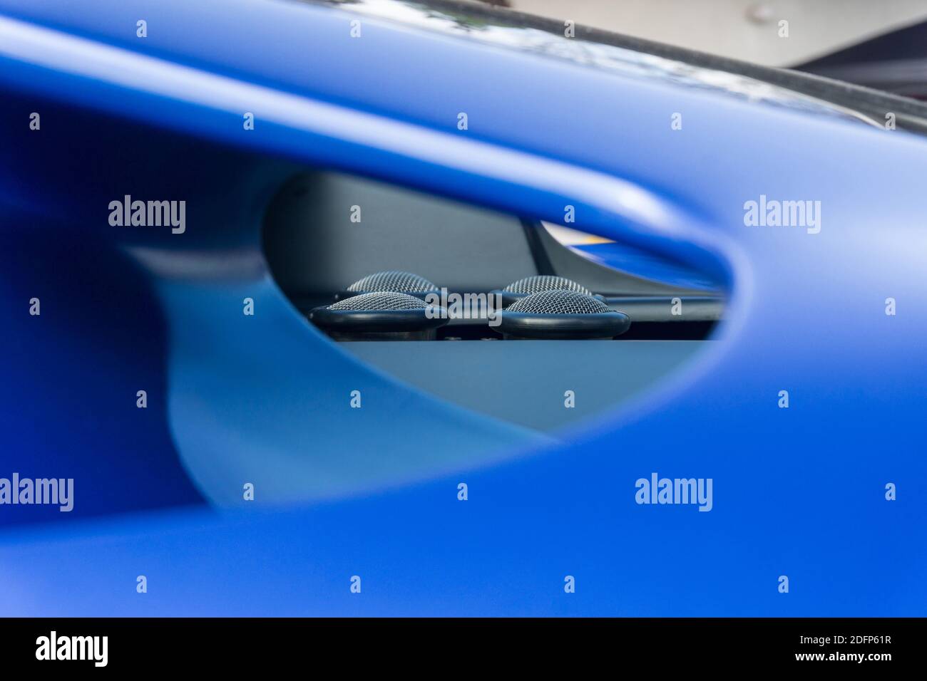 Close up of the top of the engine of a metallic blue and white ...