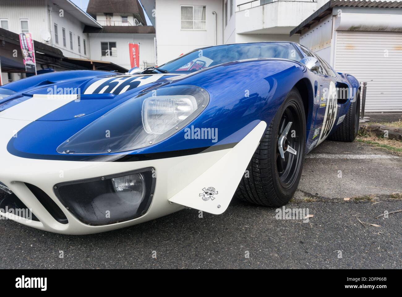 Close up detail of the front and side of a metallic blue and white ...
