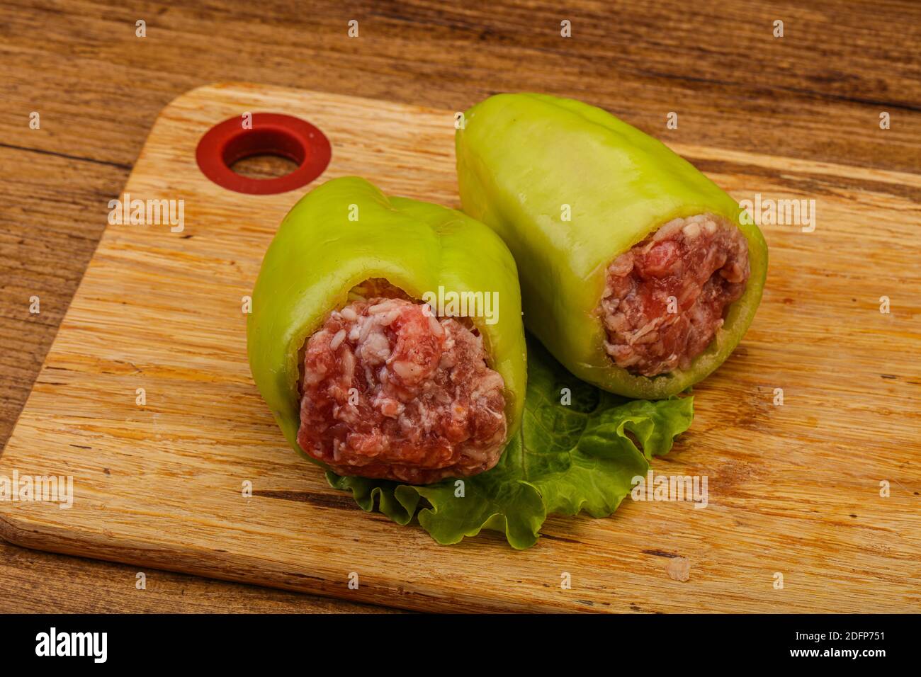 Raw stuffed green bell pepper with meat Stock Photo - Alamy
