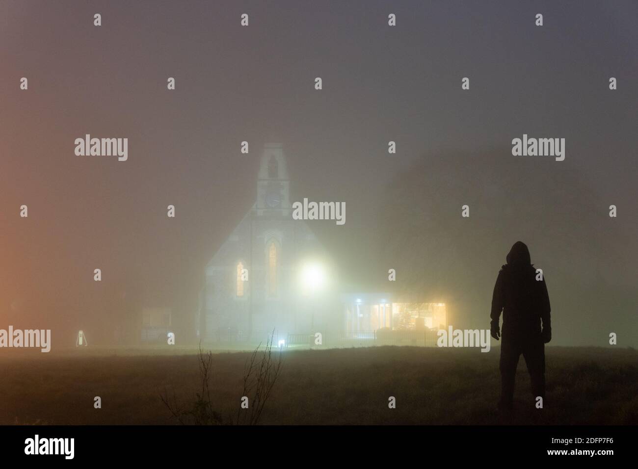 Sinister figure by church at night hi-res stock photography and images ...