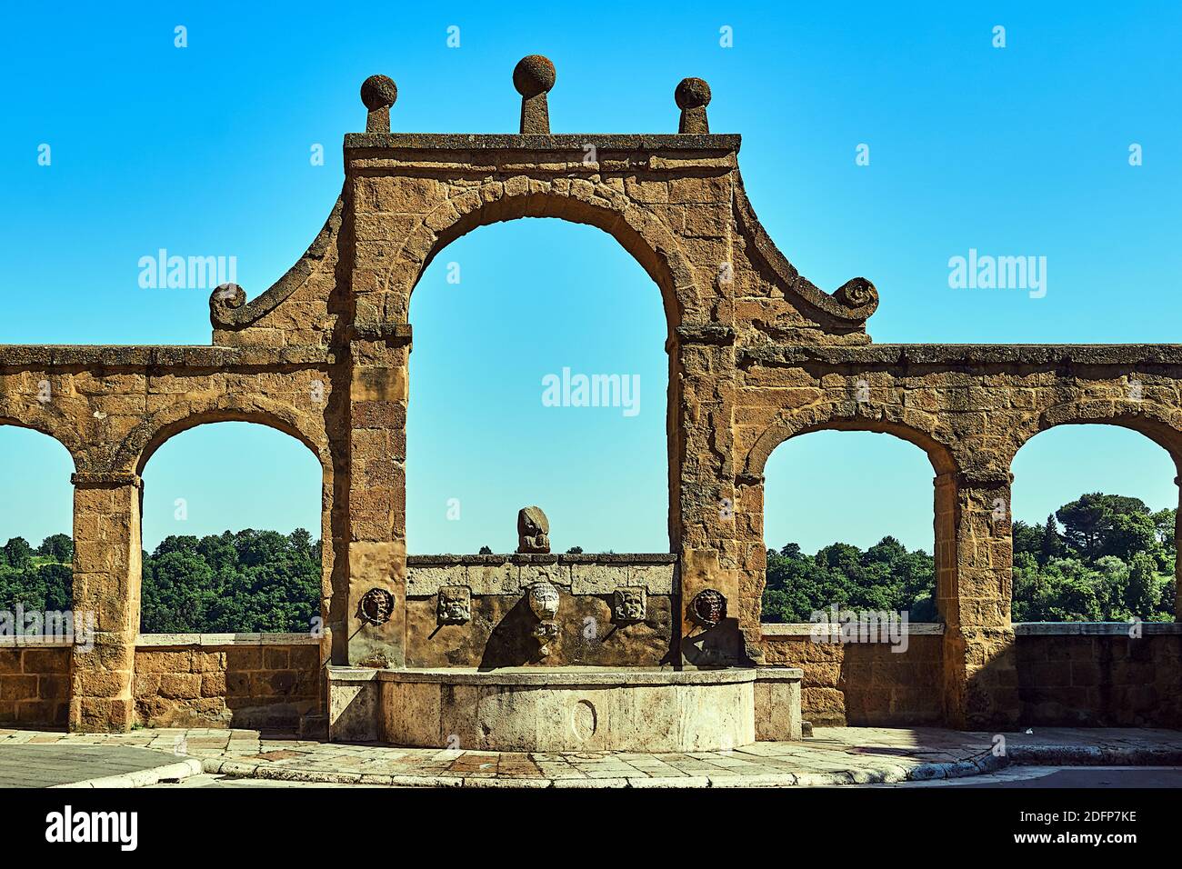 Detail of an ancient stone aqueduct in the city of Pitigliano, Italy ...