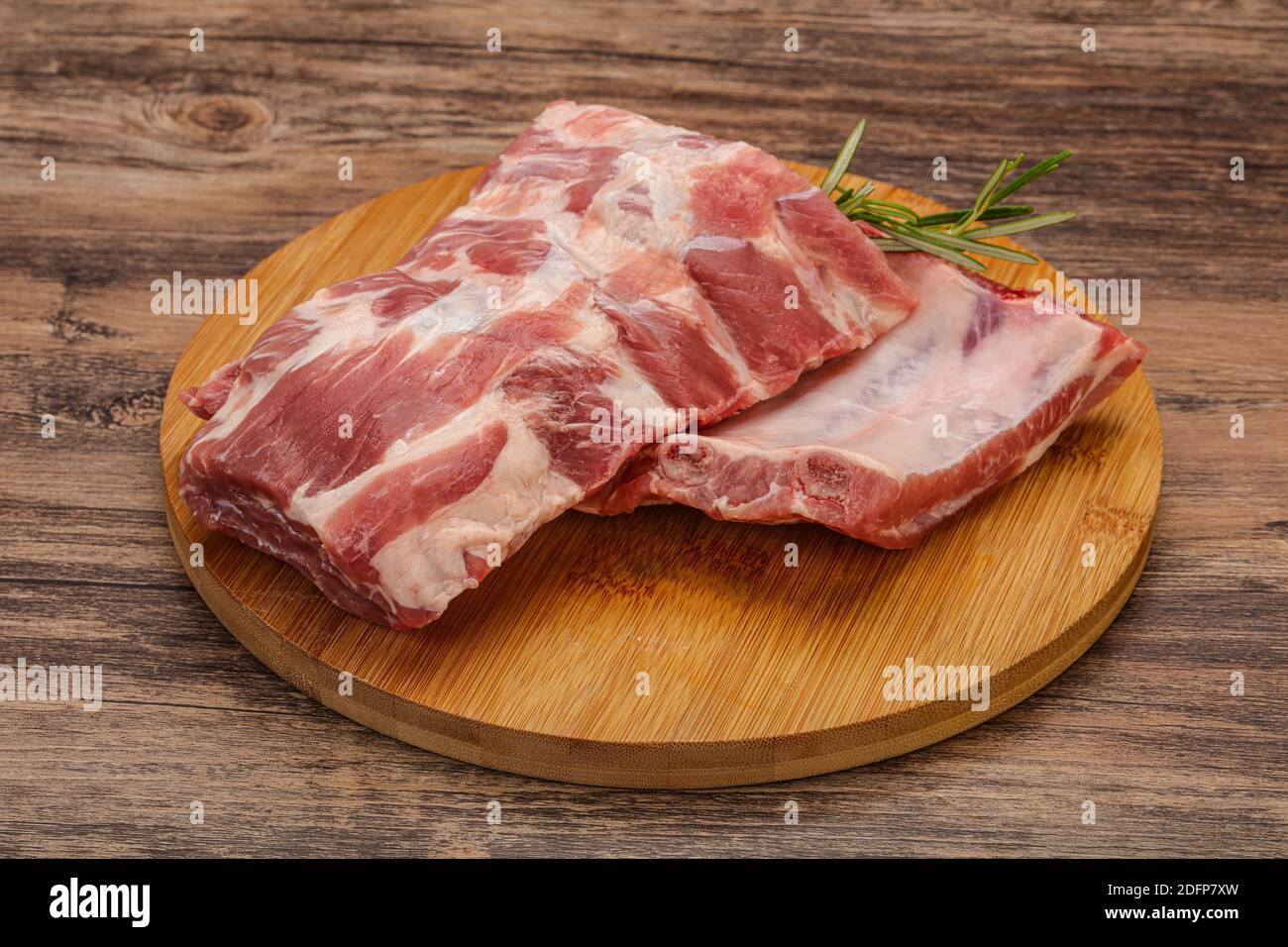 Raw pork ribs served rosemary for cooking Stock Photo - Alamy