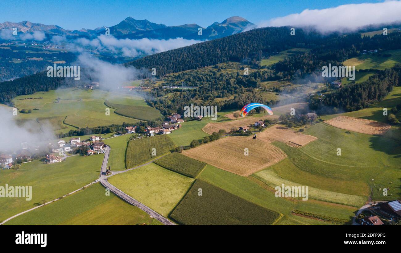 Paragliding through the clouds. Beautiful landscape. Extreme sport ...