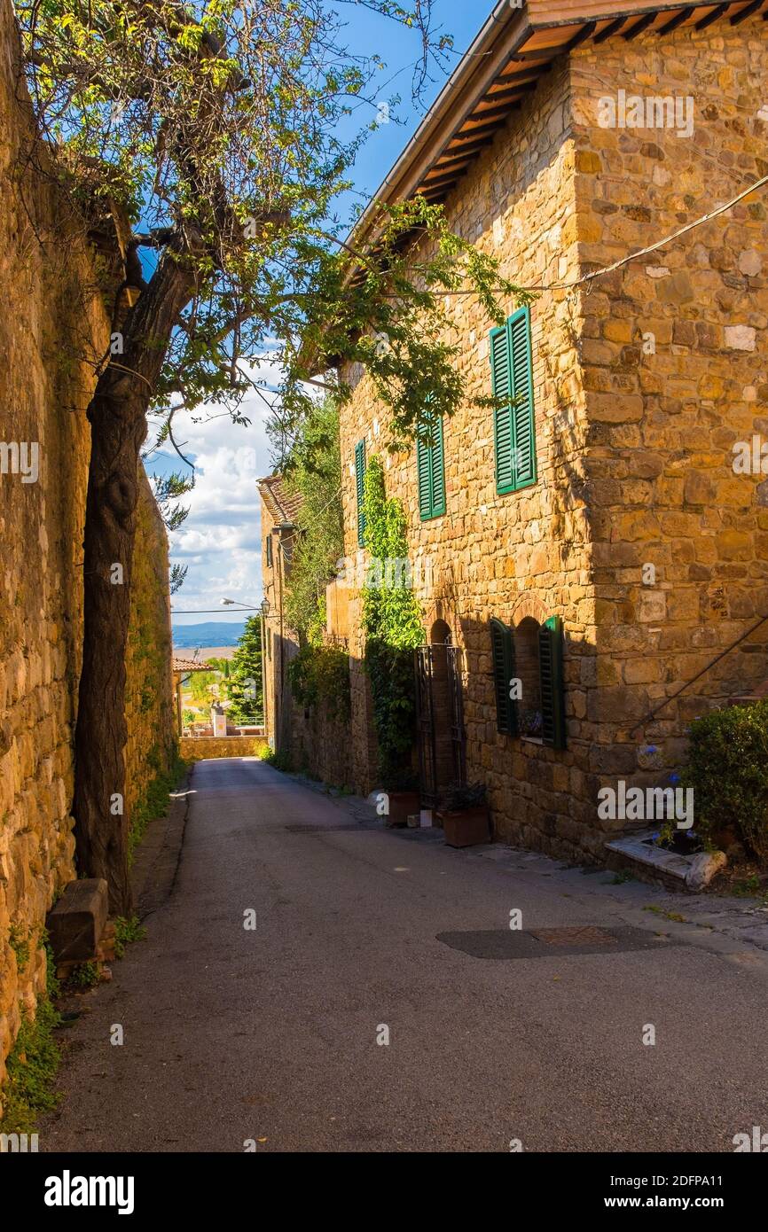 A residential road in the historic medieval village of San Quirico D ...