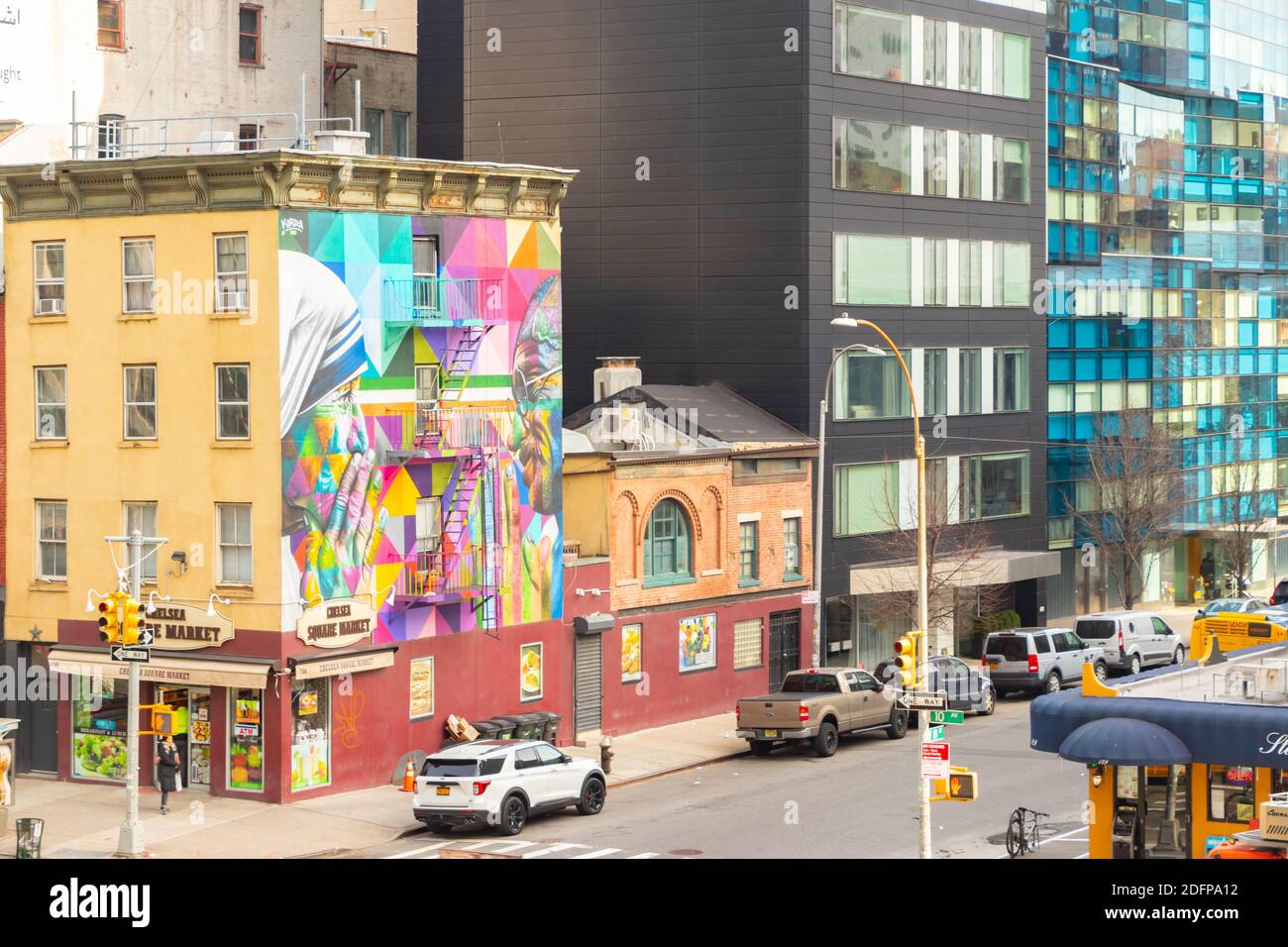 painted mural of Ghandi and Mother Theresa on wall of building on W18th ...