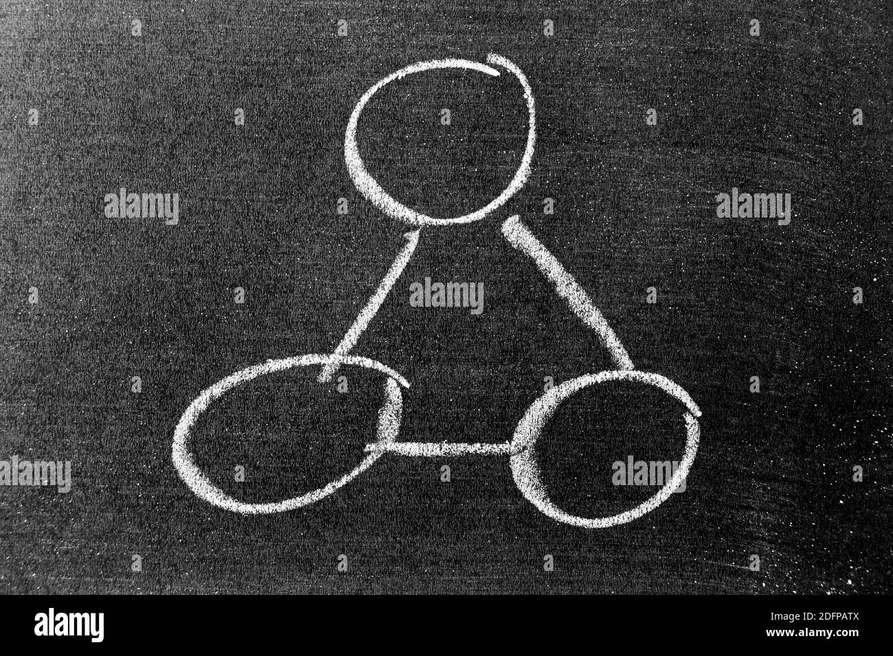 White color chalk hand drawing in three circle link with line shape on ...