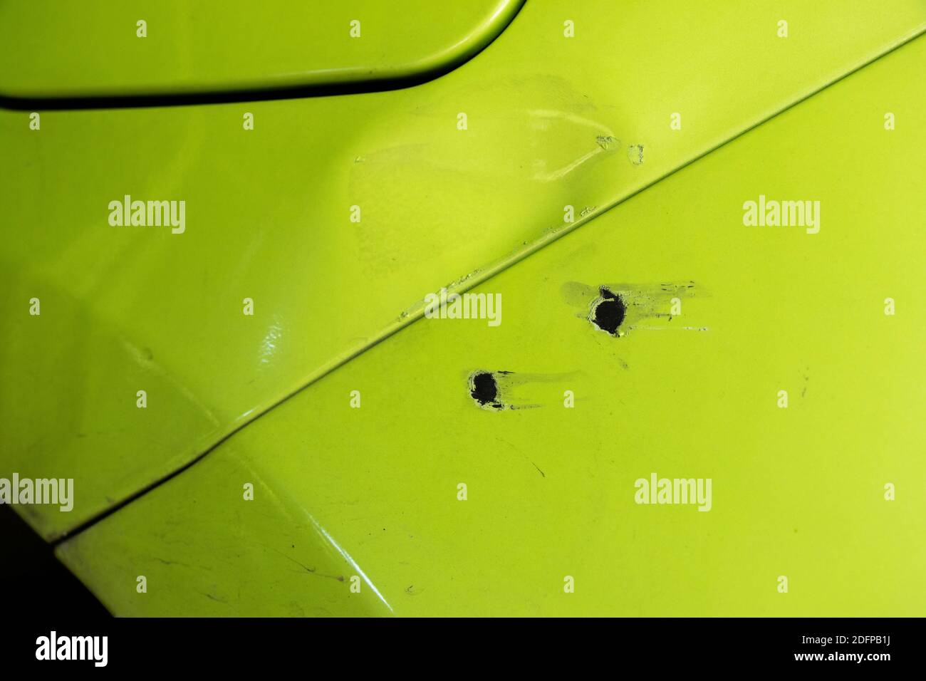 Closed up background of damaged green color bumper of car that caused ...