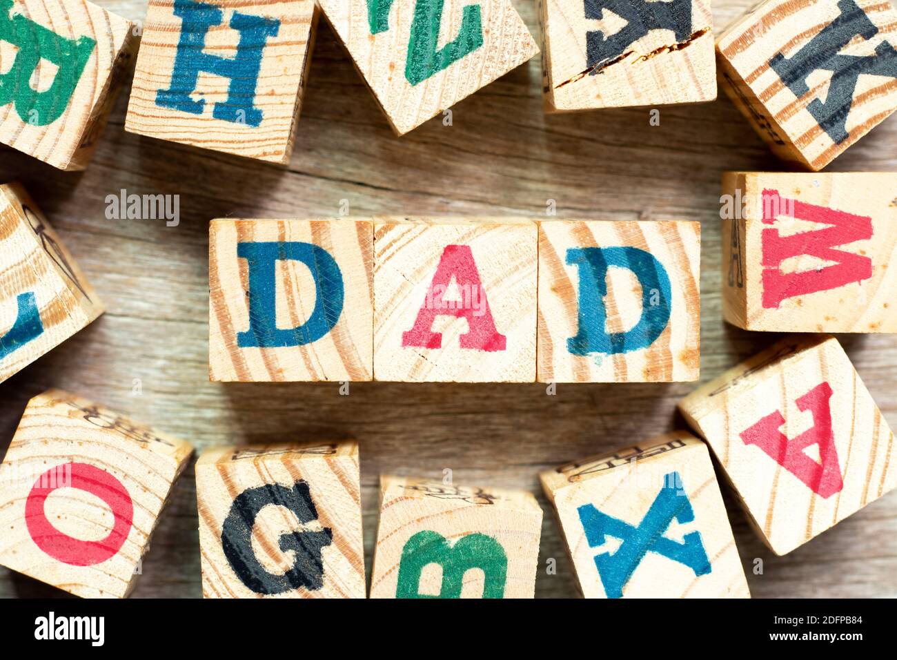 Alphabet letter block in word dad with another on wood background Stock ...