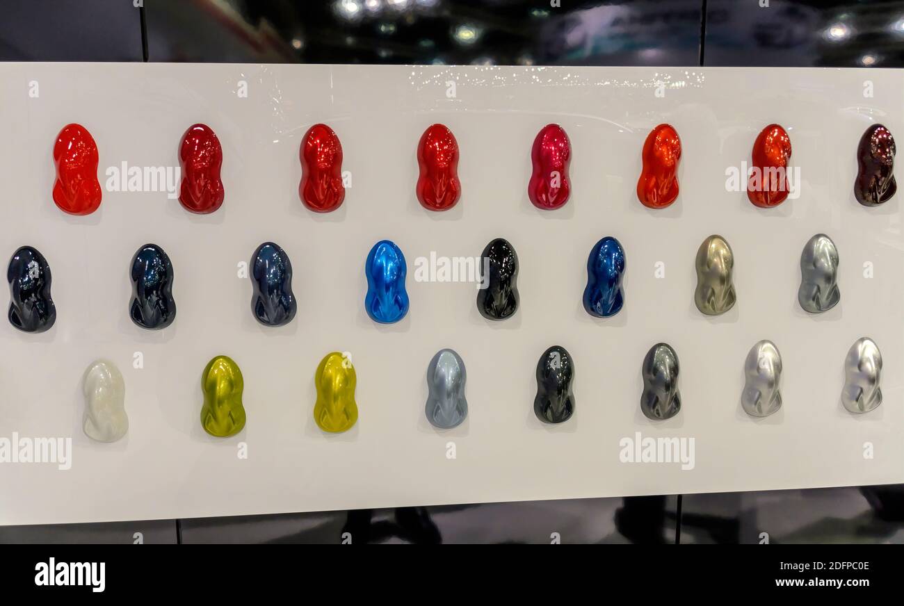 Colorful metallic glossy coated sample pieces on a white wall Stock ...