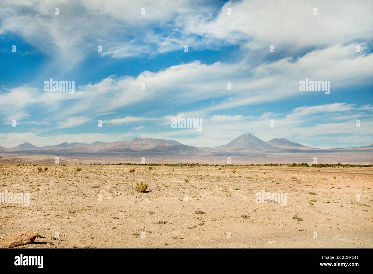 Volcan Licancabur rises above the dry plains of the Atacama Desert ...