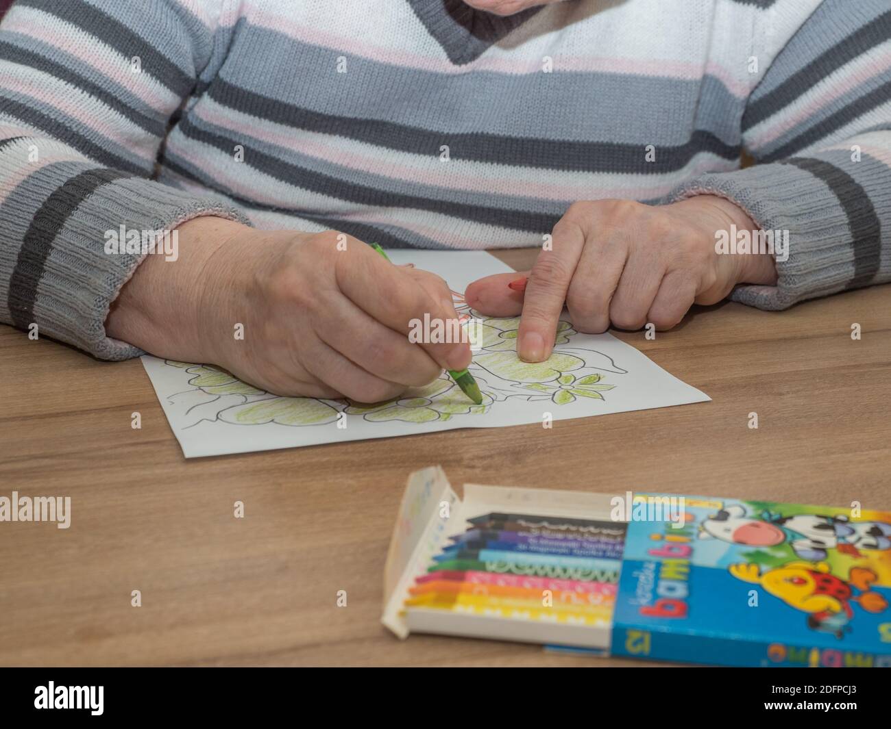 Senior activity concept. Exercises by drawing and creating decorations ...