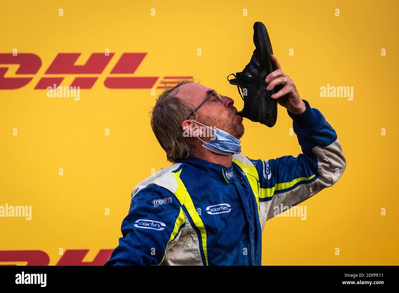 Team Carlin staff celebrates on the podium during the 12th round of the ...