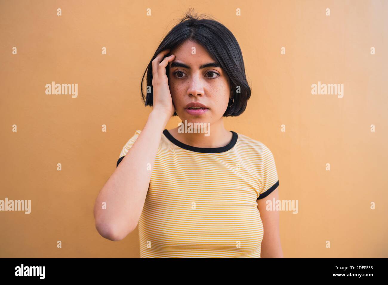 Young beautiful woman with shocked expression Stock Photo - Alamy