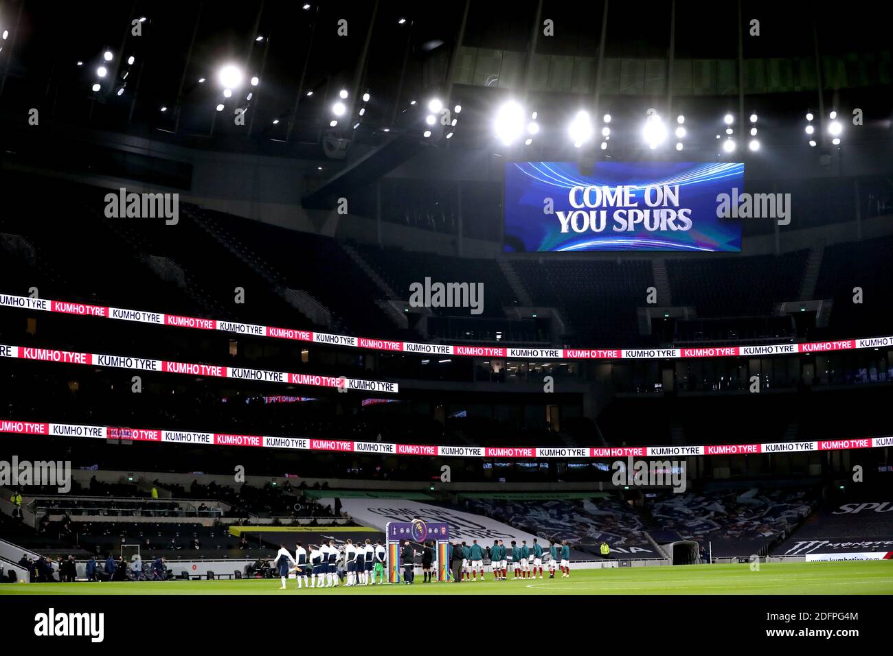 Tottenham Hotspur and Arsenal players line up prior to the beginning of ...
