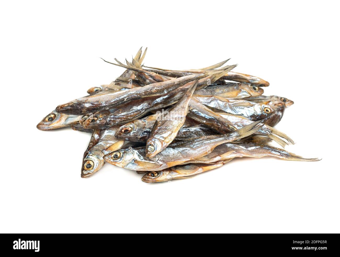 Pile of dry small fish on a white background Stock Photo - Alamy