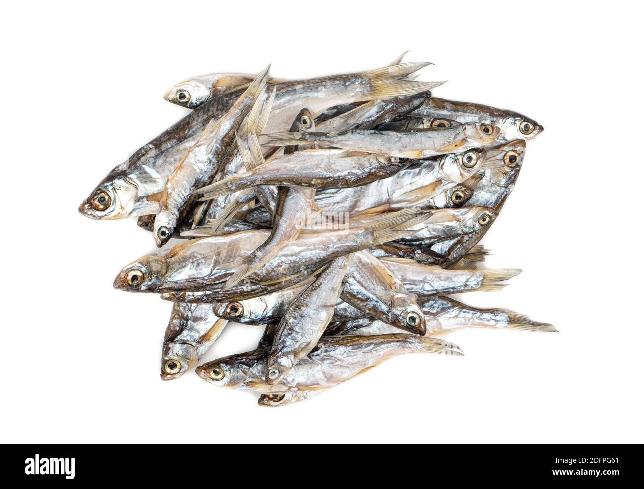 Pile of dry small fish on a white background, top view Stock Photo - Alamy