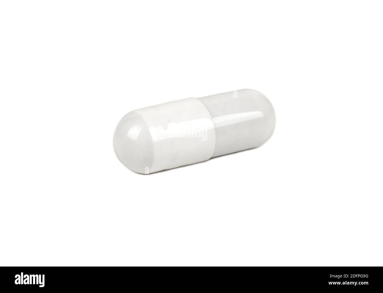 Grey capsule isolated on a white background Stock Photo - Alamy