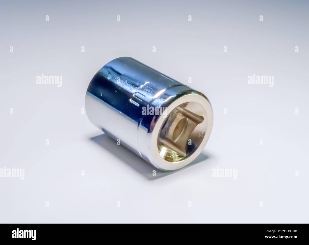 A closeup of metal ratchet socket on white background metal ratchet ...