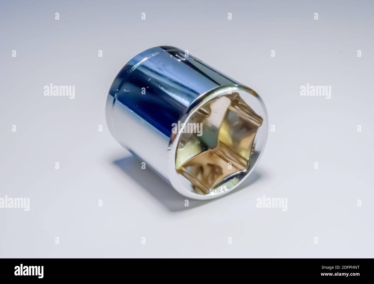 A closeup of metal ratchet socket on white background metal ratchet ...