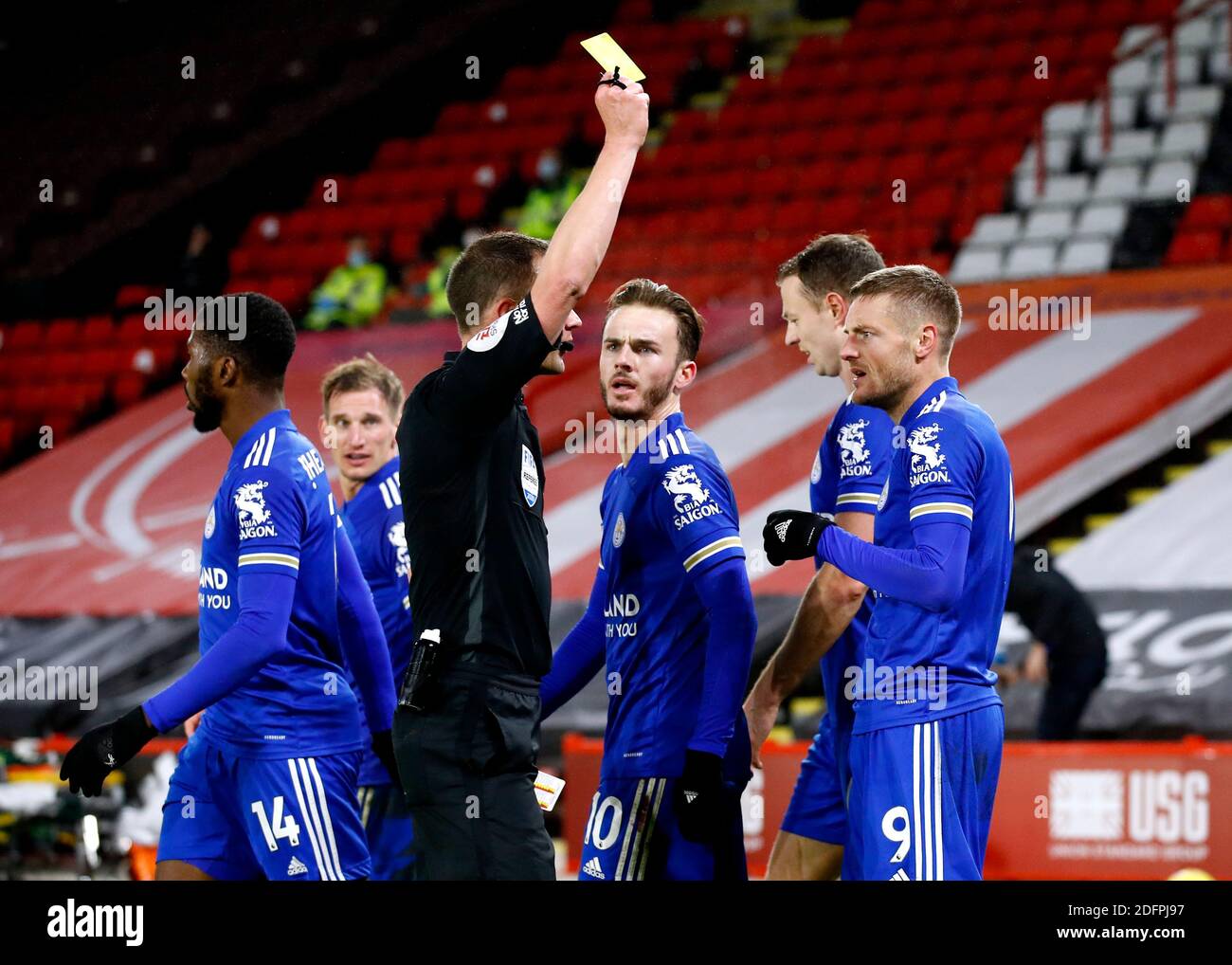 Leicester City's Jamie Vardy (right) receives a yellow card after ...