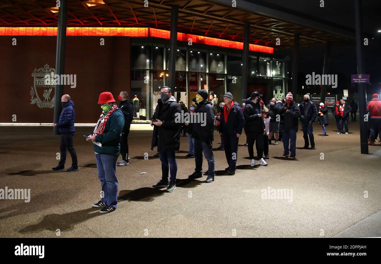 Liverpool fans socially distance as they make their way in to the ...