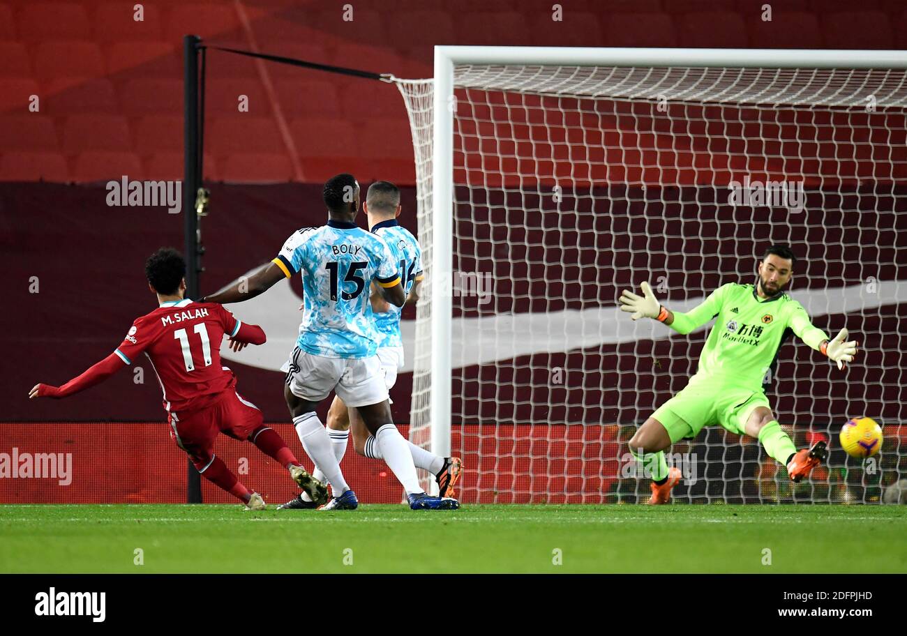 Liverpool's Mohamed Salah (left) scores his side's first goal of the ...