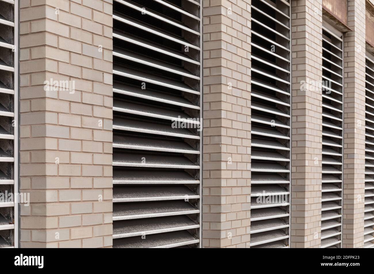 Perspective view of wall of an urban commercial building with numerous ...