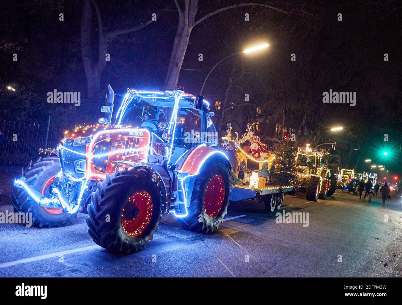 Hamburg, Germany. 06th Dec, 2020. A parade of tractors illuminated for ...