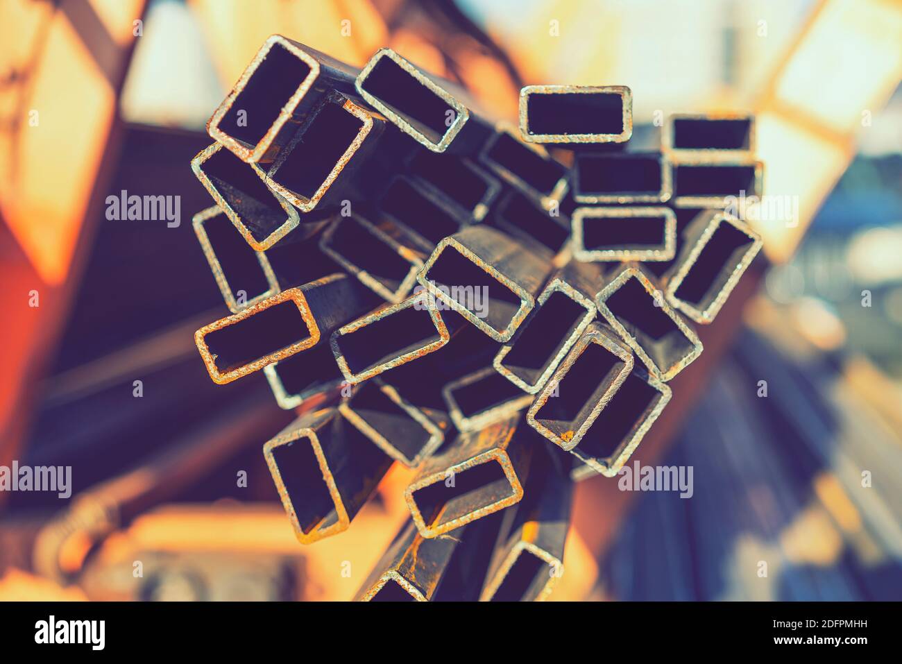 stack of steel pipe and metal beams on rack. metal pipes, profiles ...