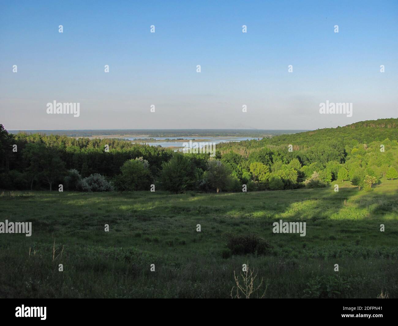 landscape: green trees and a river far away Stock Photo - Alamy