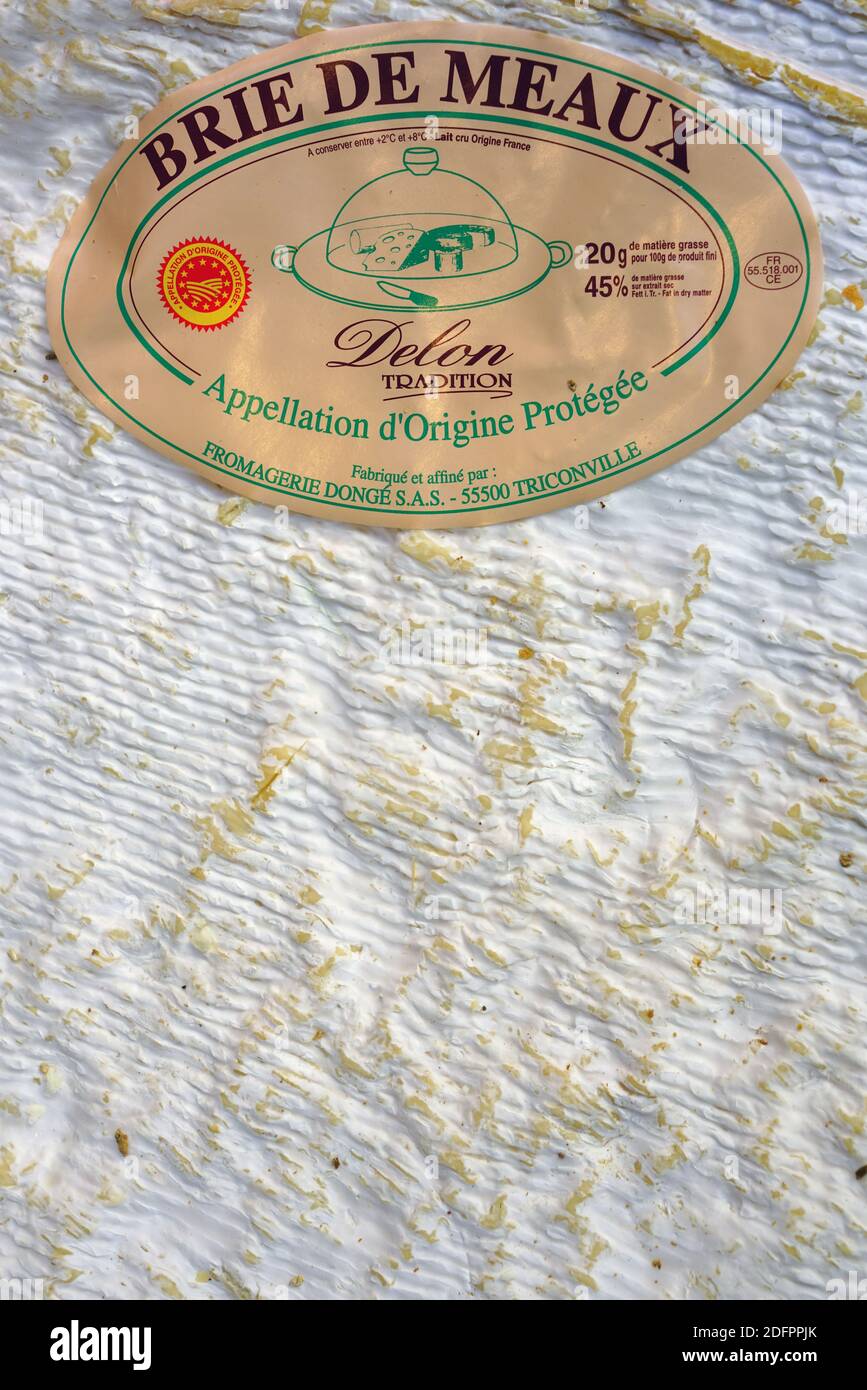 PARIS, FRANCE -23 DEC 2019- View of a wheel of ripe Brie de Meaux ...