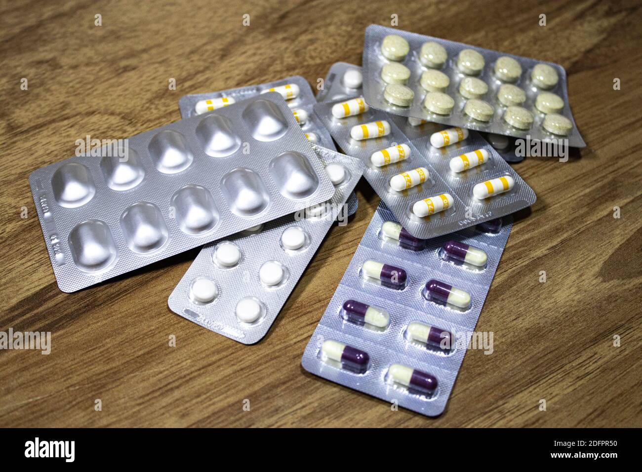 Colorful medicine capsules standing on the table Stock Photo - Alamy
