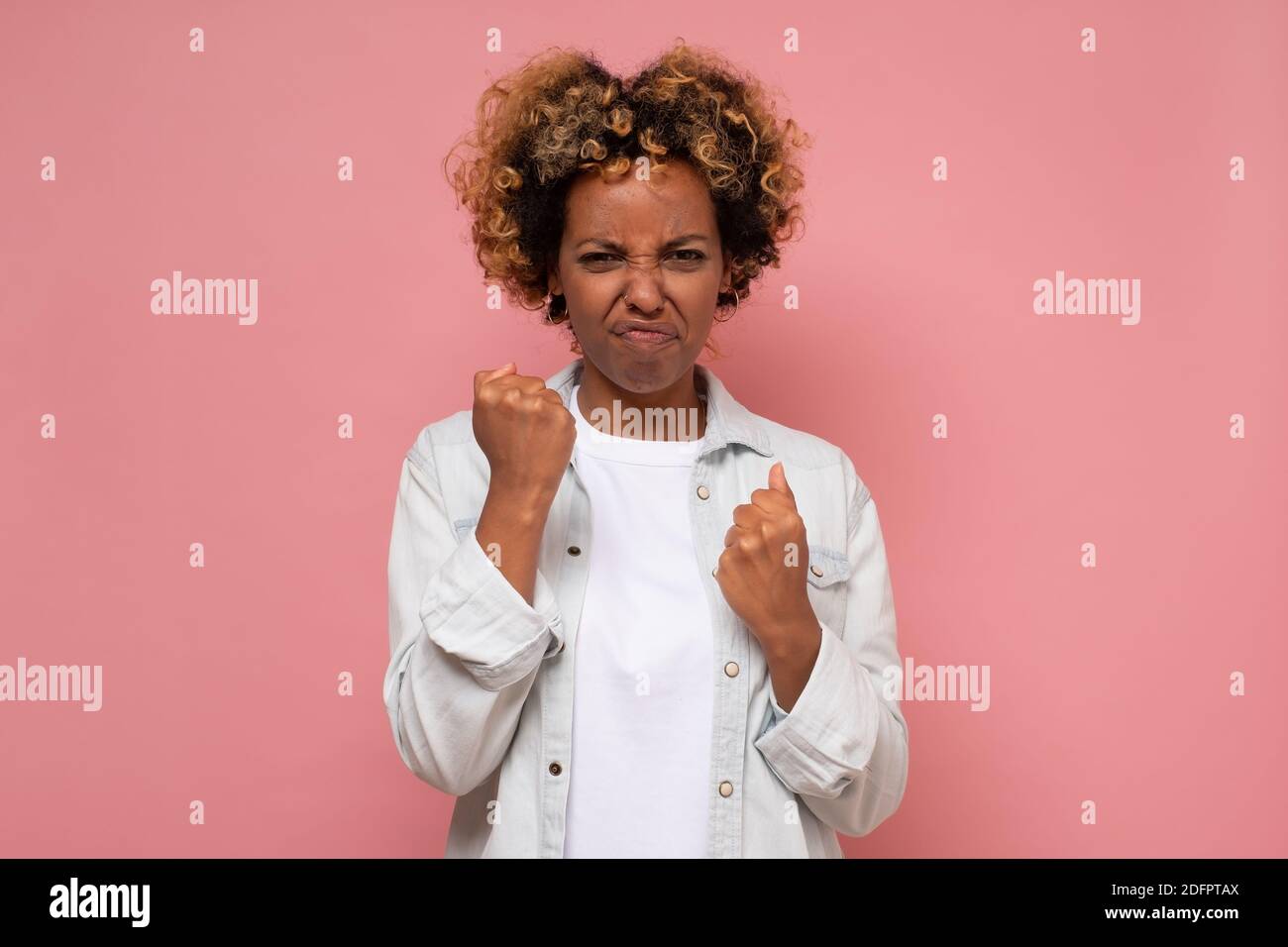 Annoyed irritated african woman gesture expressing fury and madness ...
