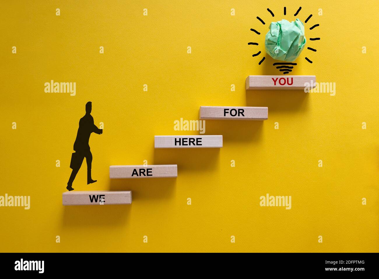 Support symbol. Wooden blocks with words 'we are here for you ...