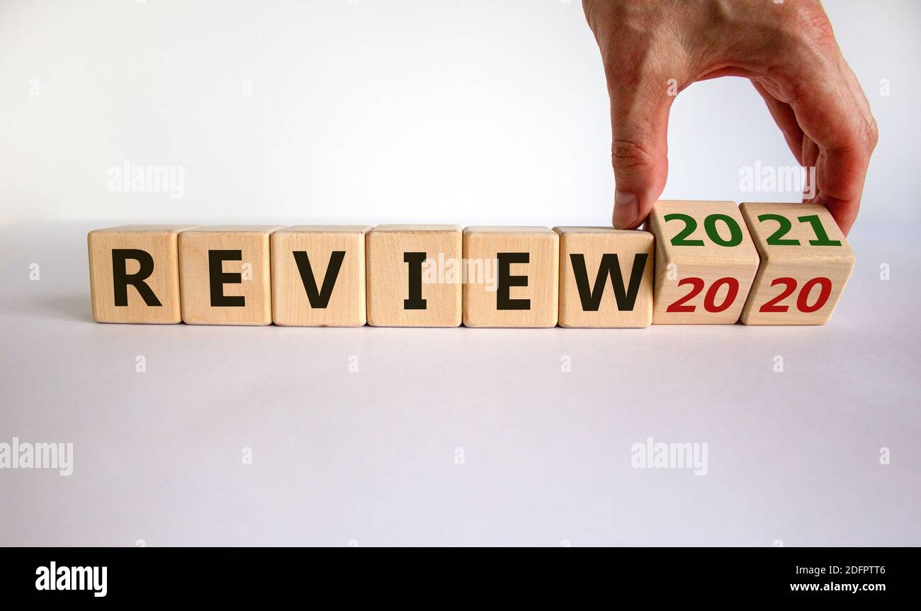 Business concept of planning 2021. Male hand flips wooden cubes and change the inscription ...