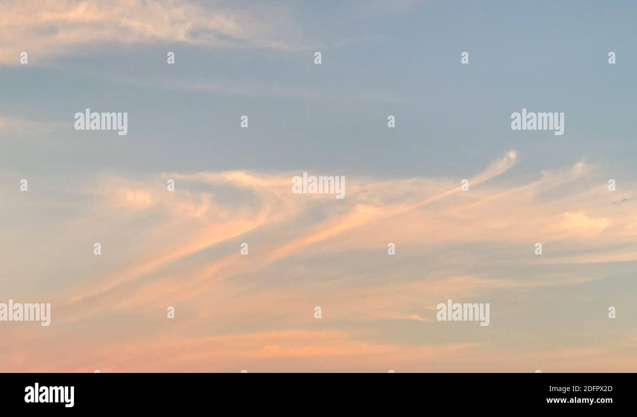 A low angle shot of a soft blue sky during the sunset in the evening ...