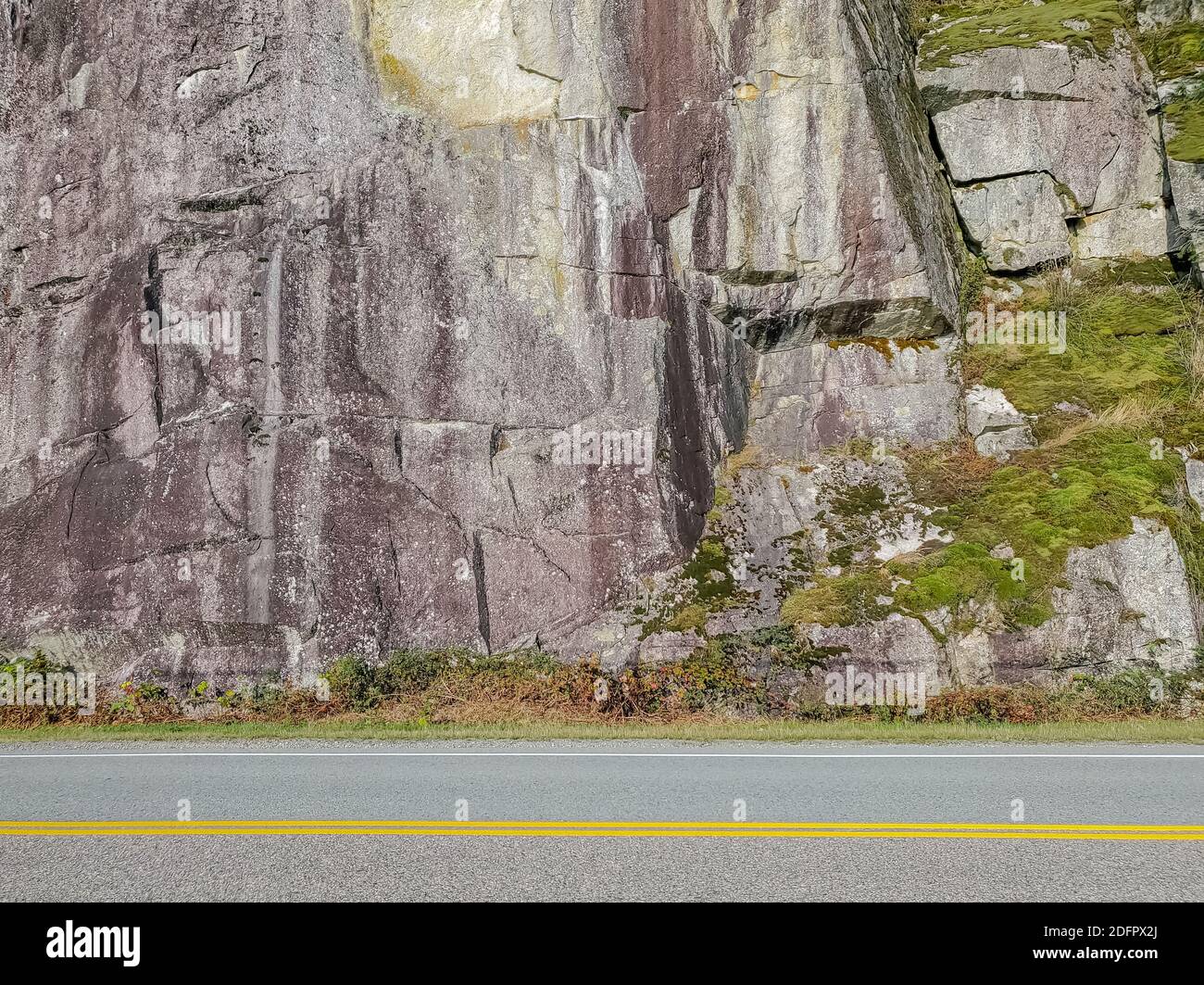 A rocky side of a mountain by a road in British Columbia province Stock ...