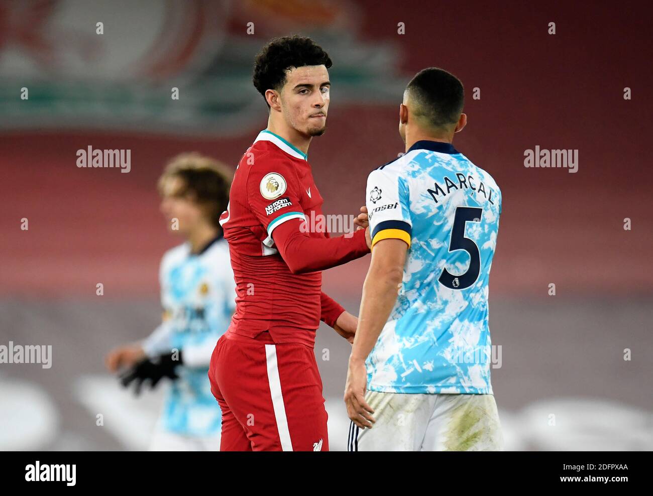 Liverpool's Curtis Jones greets Wolverhampton Wanderers' Marcal after ...