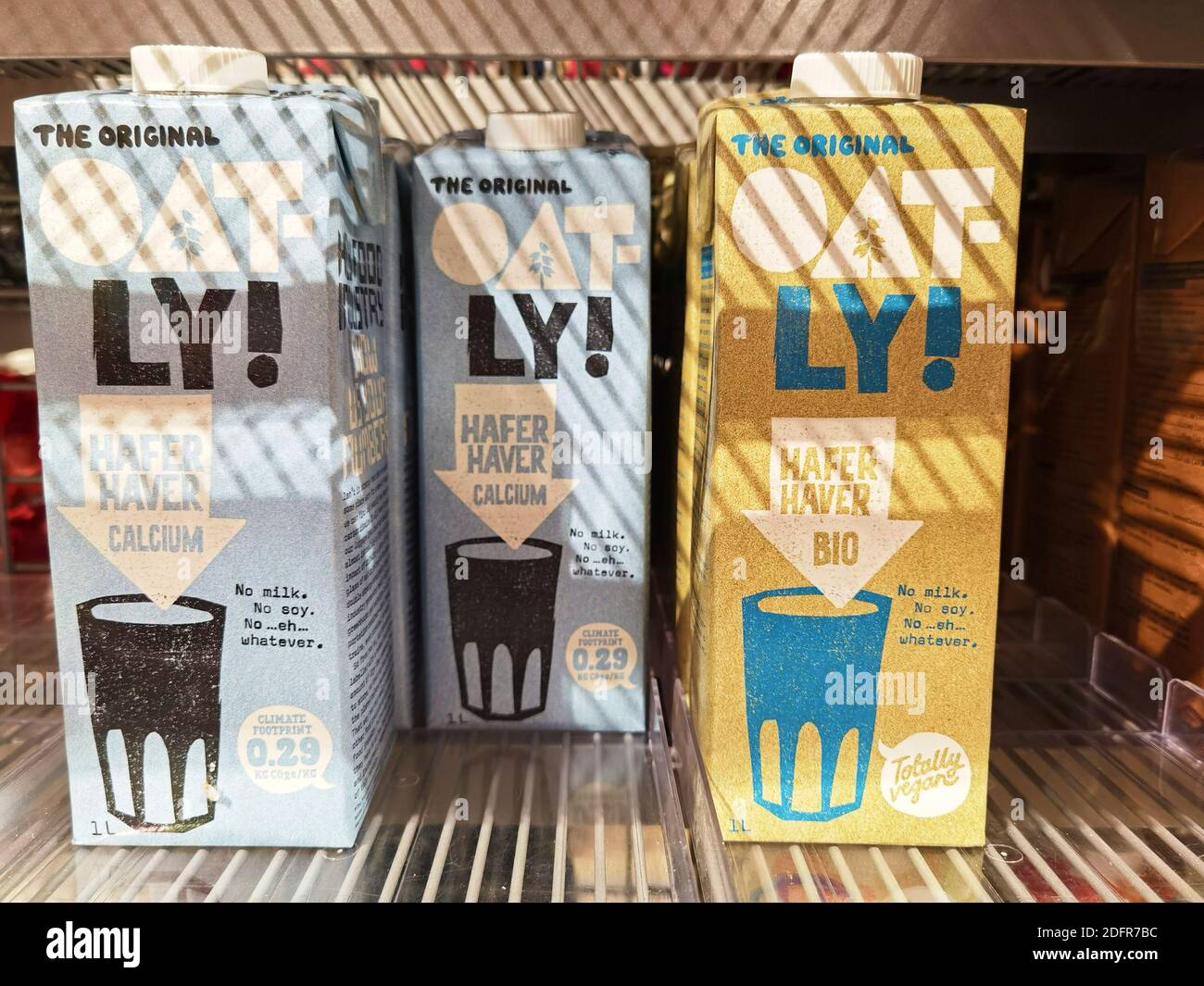 Berlin, Germany - December 1, 2020: View to a shelf with different milk ...