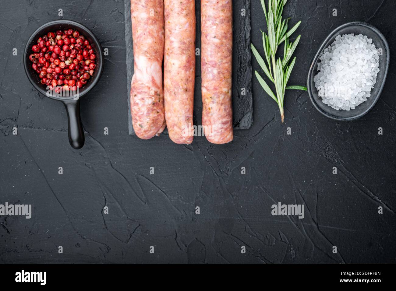 Traditional beef sausages, top view with space for text, on black ...